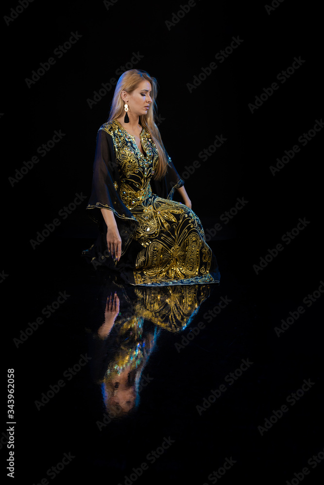Young woman oriental dancer in national traditional Khaliji dress with ...