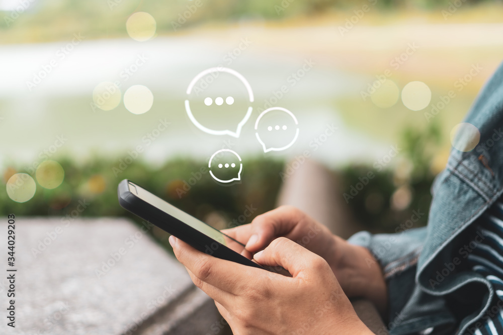 Women hand using smartphone typing, chatting conversation in chat box ...