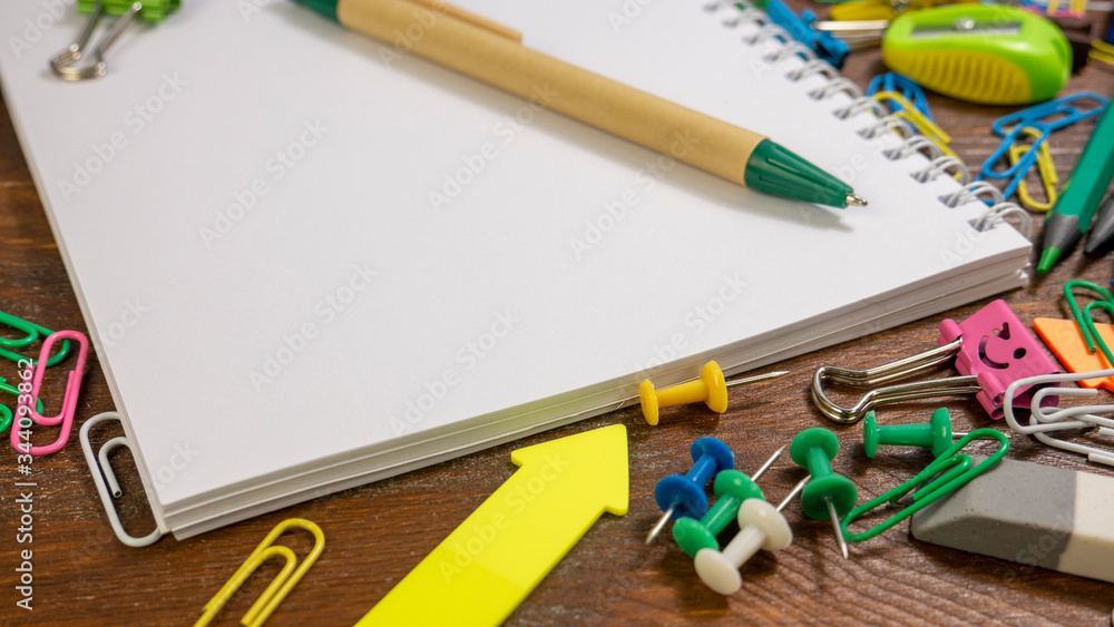 Different tools used at an office. School stationery on brown wooden ...