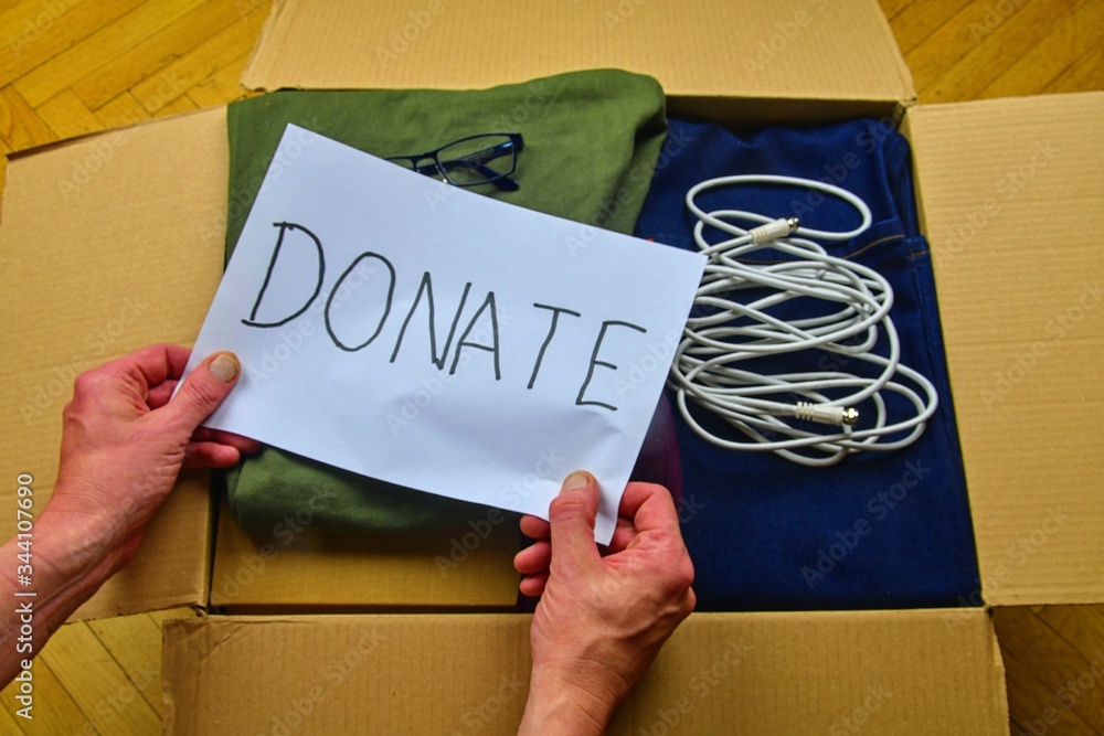 Donation concept. Donation box with donation clothes and accesories ...