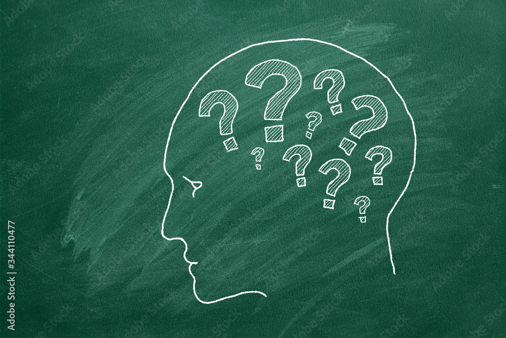 Human head with question marks inside on green chalkboard. Stock Photo ...