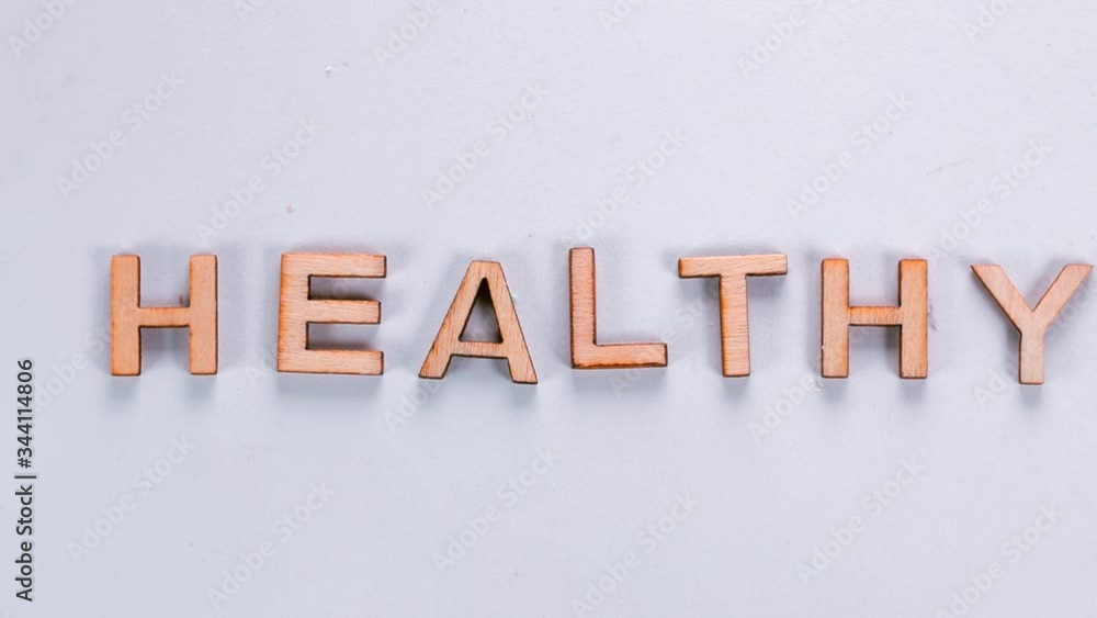 Word Healthy. The word is made in dancing letters. The state of ...