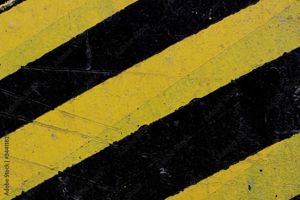 Warning painting of a post in a warehouse. Sign of attention for ...