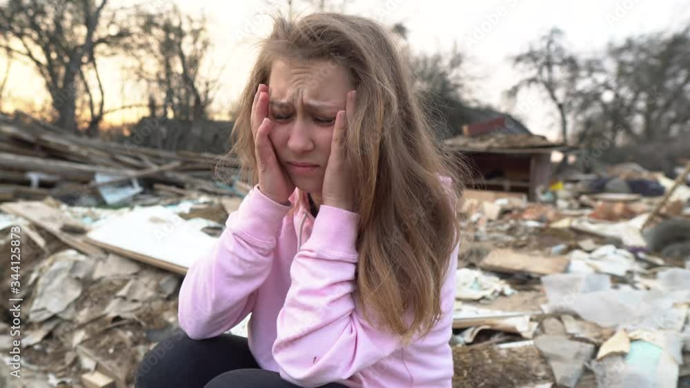 The burned man is crying. The girl is crying because the house burned ...
