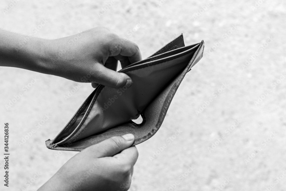 Poor man hand open an empty wallet isolated on white background ...