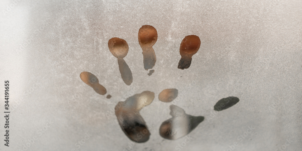 Handprint on a foggy window Stock Photo | Adobe Stock