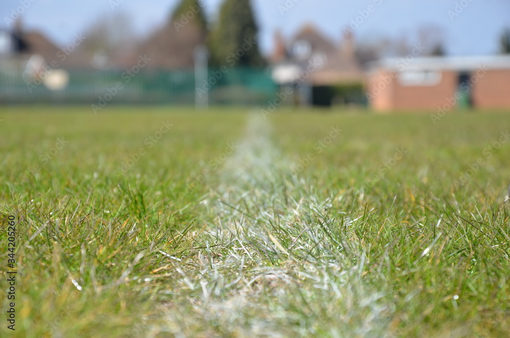 Closeup view of white line on football playground. Detail of a of white ...