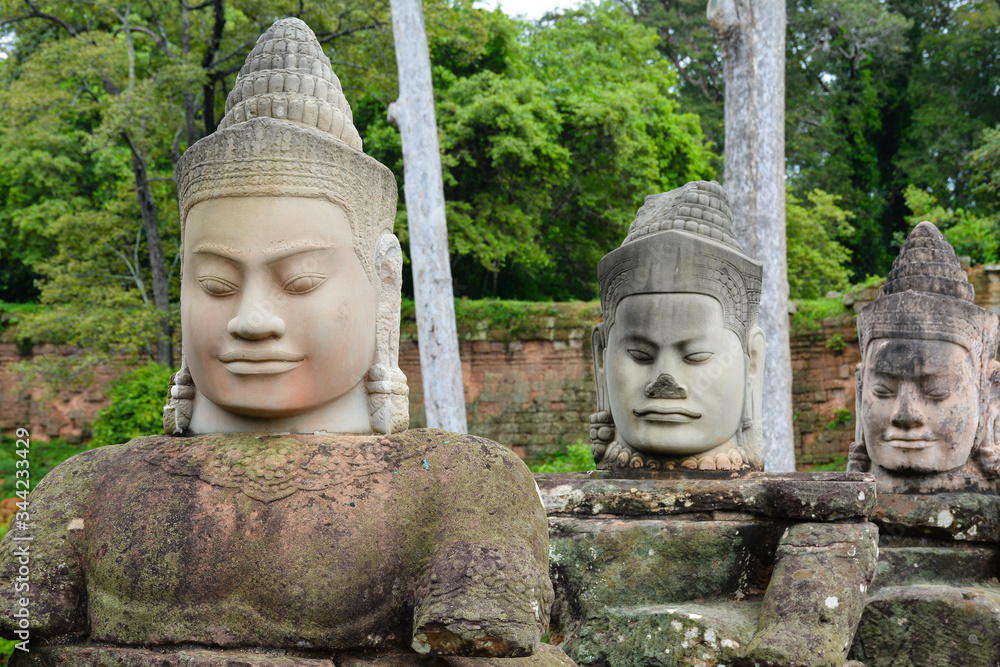 Statues of Devas (Buddhist demigods) along the entrance to Bayon Temple ...