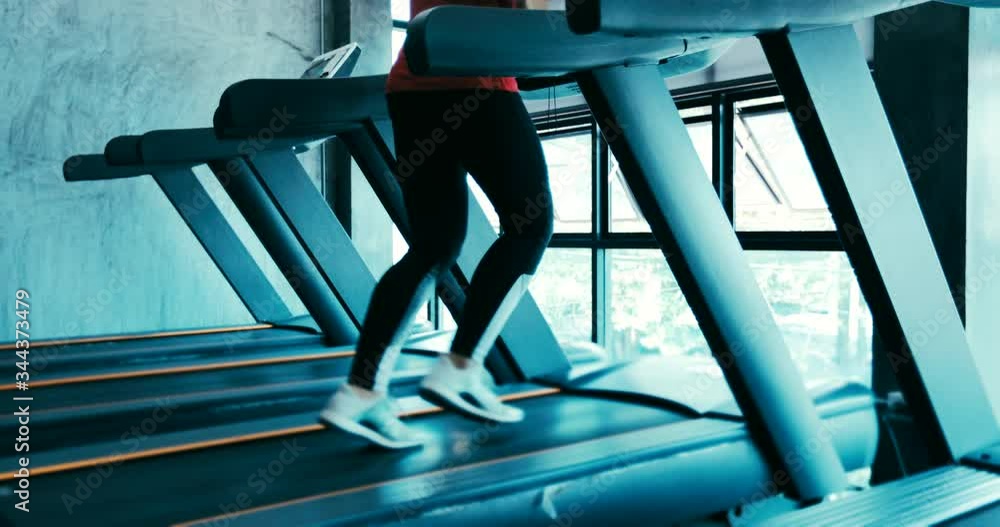 Scene of woman running on the treadmill in the gym, Concept of woman ...