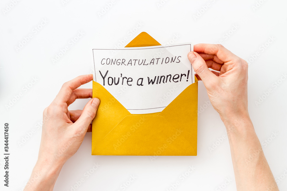 Congratulations You're a winner. Hands holding envelope with letter ...