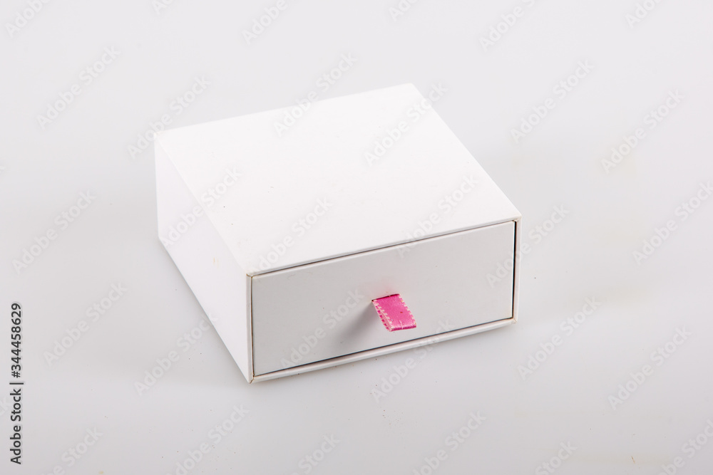 white small cardboard sliding box with drawer pink ribbon Stock Photo ...