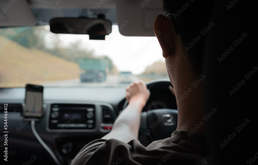 Close-up Of Man Driving Car On Road In City Stock Photo | Adobe Stock