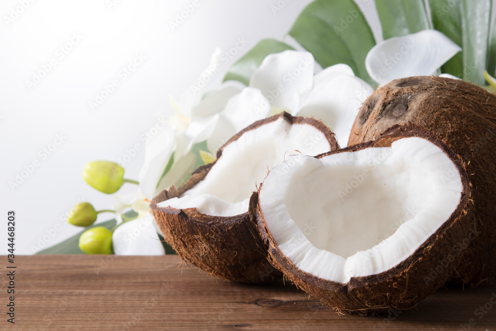 natural open coconut fruit with tropical leaves Stock Photo | Adobe Stock