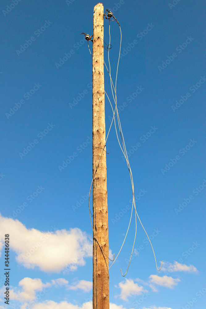 Old wooden pole with broken electric wires. Close-up view of old ...