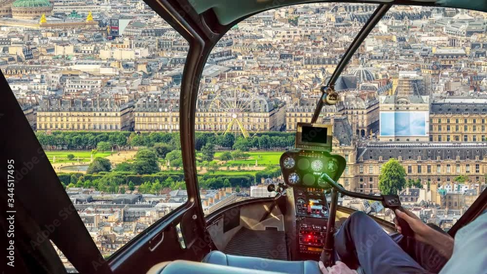Helicopter cockpit flying on of Louvre museum palace of Paris city ...