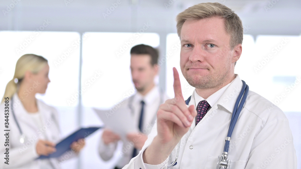 Serious Male Doctor saying No by Finger Sign Stock Photo | Adobe Stock