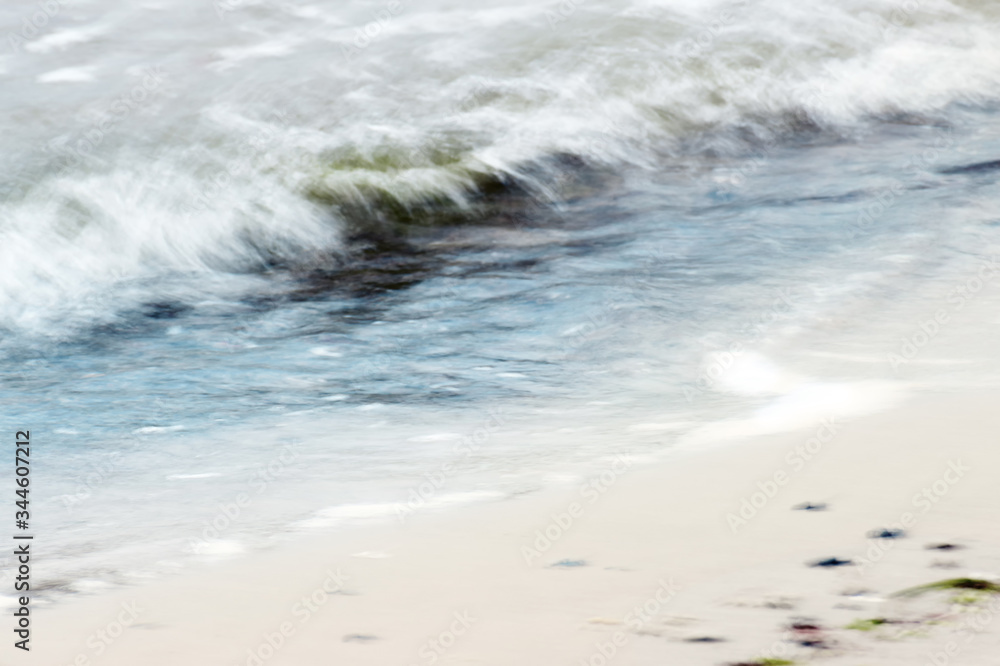 Abstract sea wave on the beach, long term exposure combined with ...