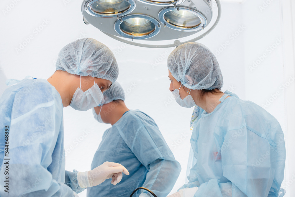 Operation in a modern operating room close-up, emergency rescue and ...