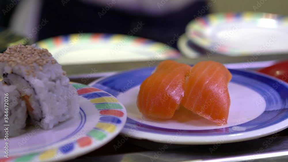Slow motion of sushi on moving conveyor belt in a Japan restaurant ...