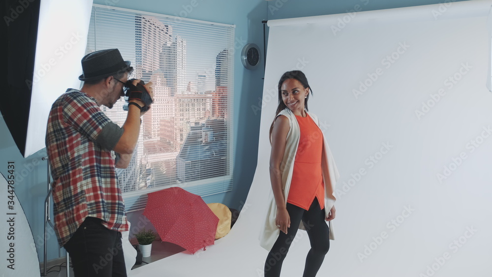 Backstage of photo shoot: multiracial young woman posing for fashion ...