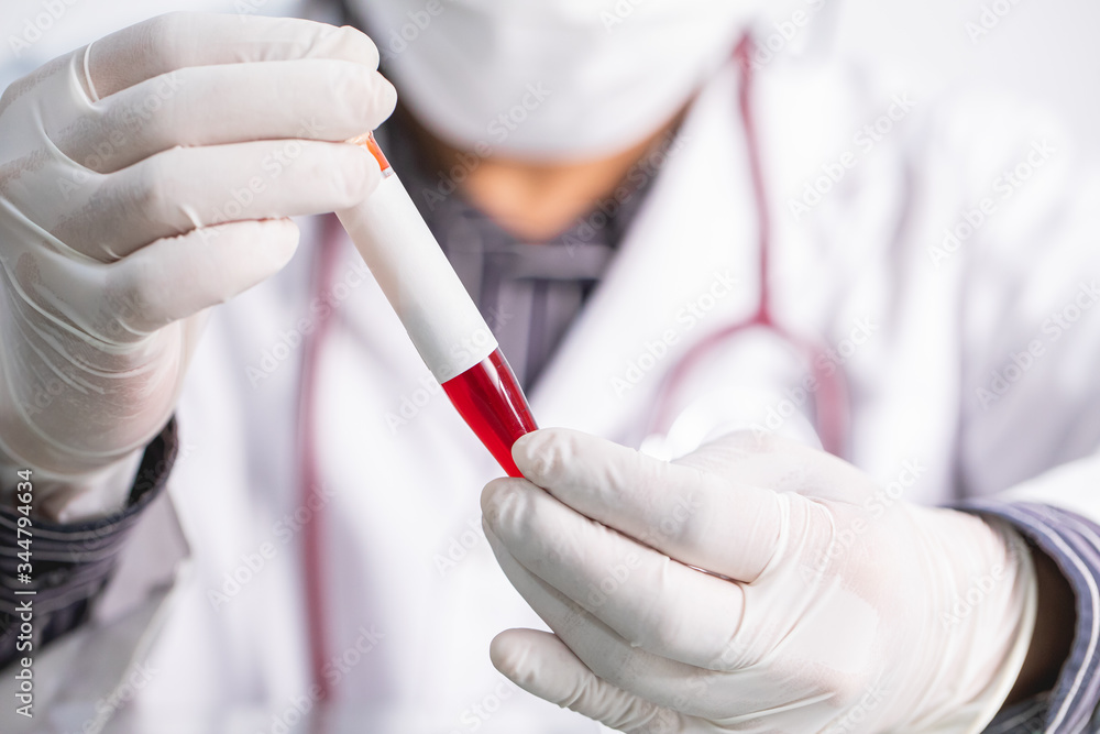 Coronavirus Covid 19 infected blood sample in sample tube in hand of ...
