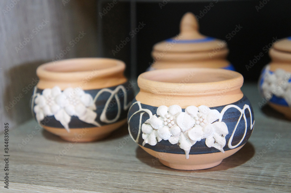 Traditional Malaysian pottery that has been commercialized. Decorated ...