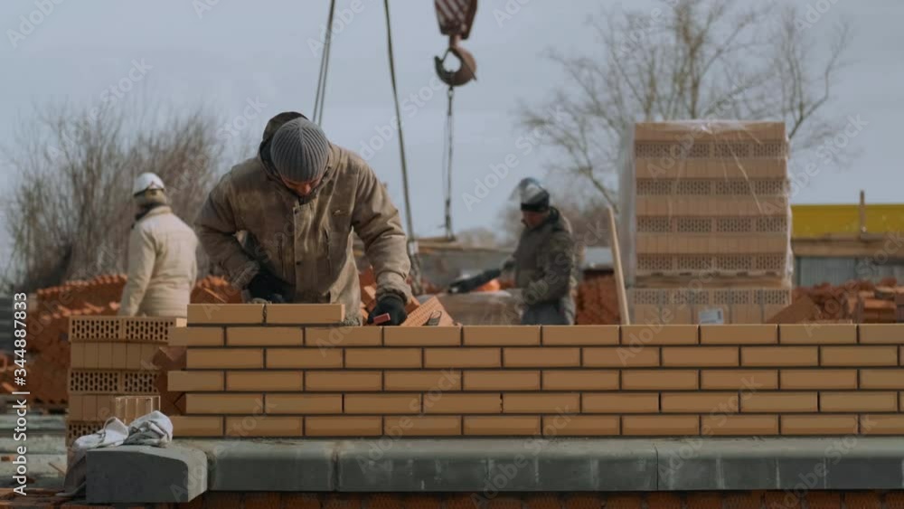 Mason Worker Checks Quality of Work done by Level, Builder Makes ...