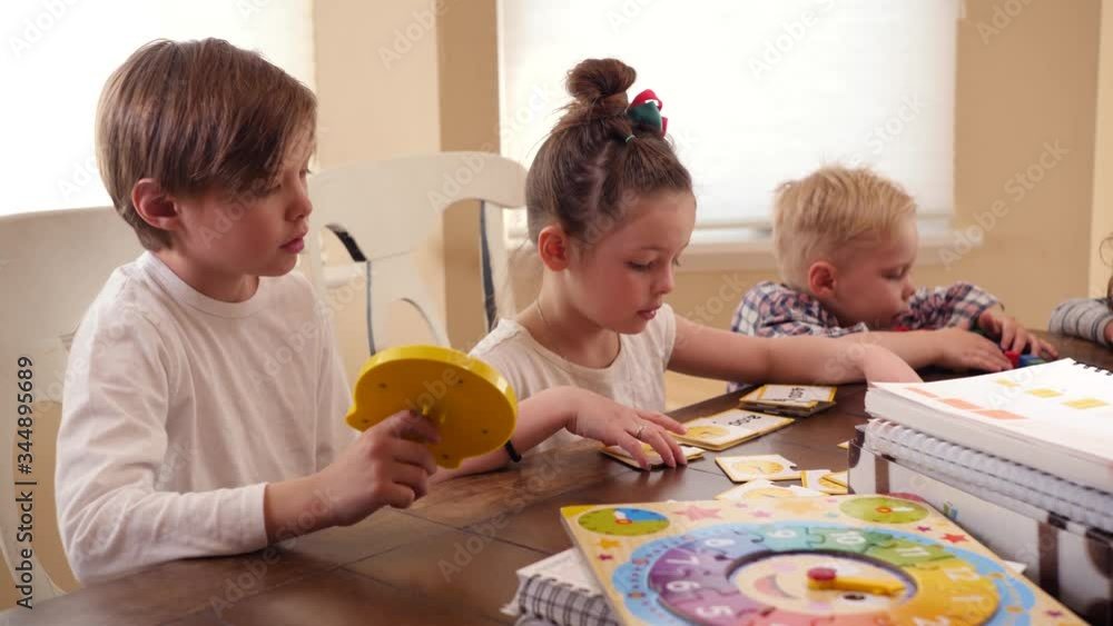 Young Kids Learning How To Tell Time Using Illustrations. High angle ...