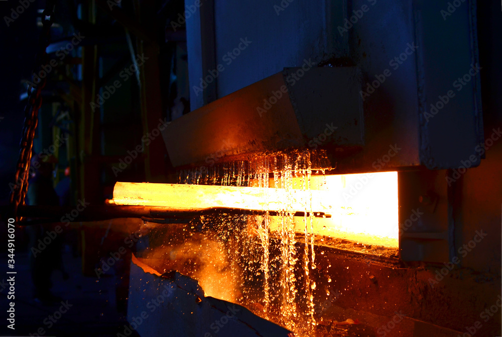 Foto de Steel quenching at high temperature in industrial furnace at ...