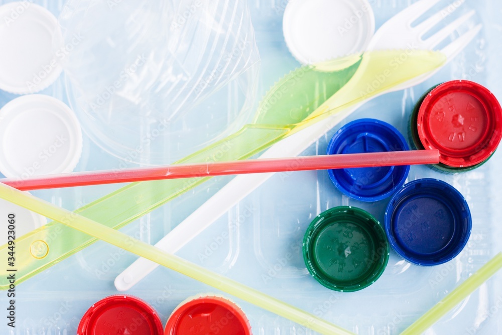 Pile of single use plastic garbage including water bottles, drinking ...