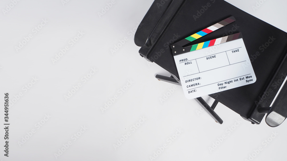 Clapper board or or movie slate with director chair.It put on white ...