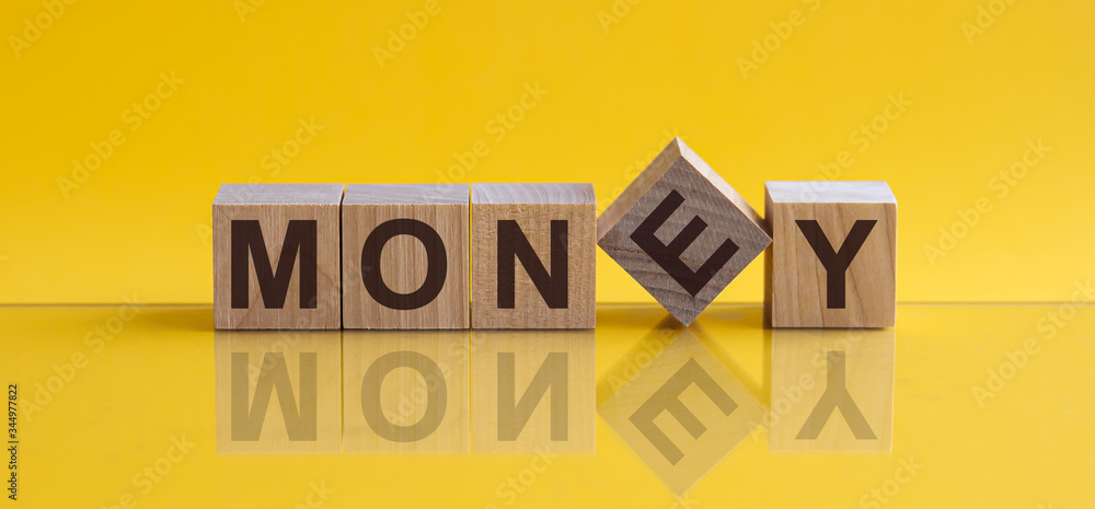 MONEY - word from wooden blocks with letters, sorry concept, yellow ...