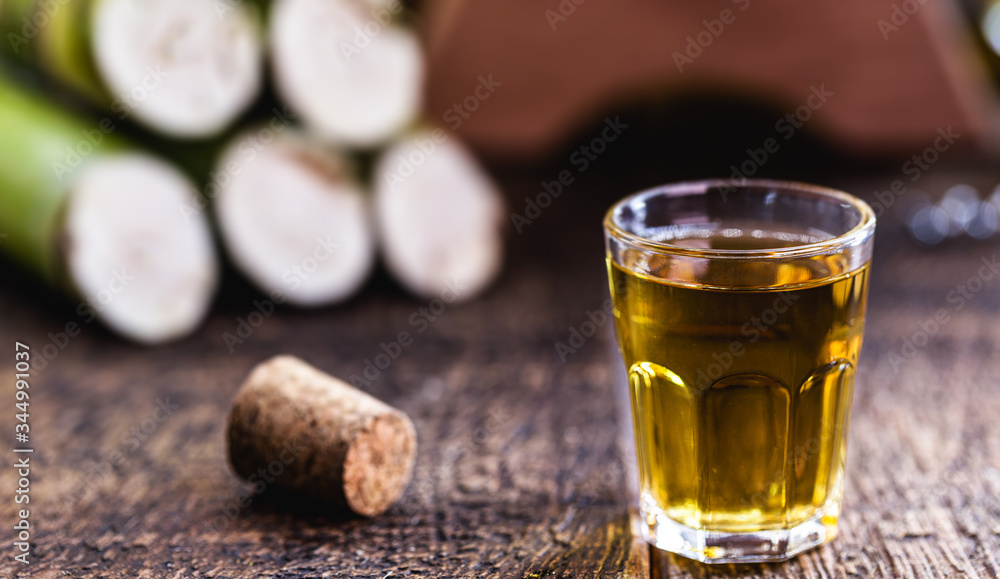 Glass of drink of high quality distilled alcohol. With pieces of sugar ...