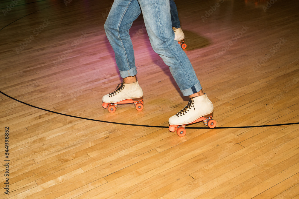 Legs of people roller skating in a wood skate ring. Stock Photo | Adobe ...