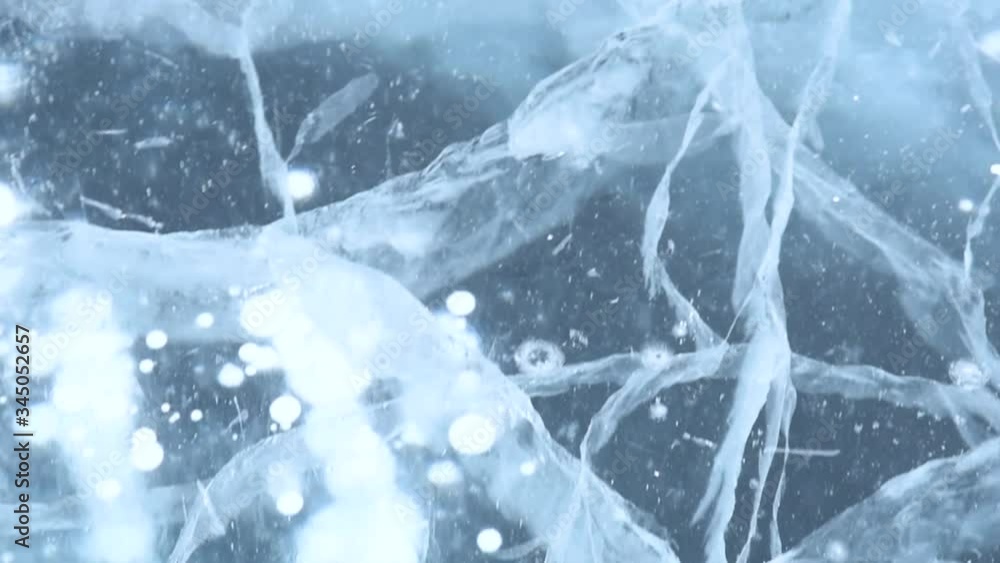 Ice texture close-up. Frozen Baikal lake in Siberia. Beautiful cracked ...