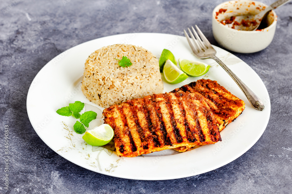 Grilled Paneer Steaks with Herbed Rice and Piri Piri Sauce, Garnished ...