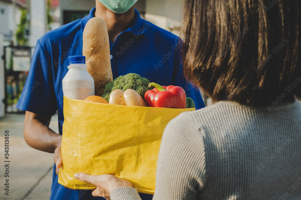 woman customer receiving fresh food set bag from food delivery service ...