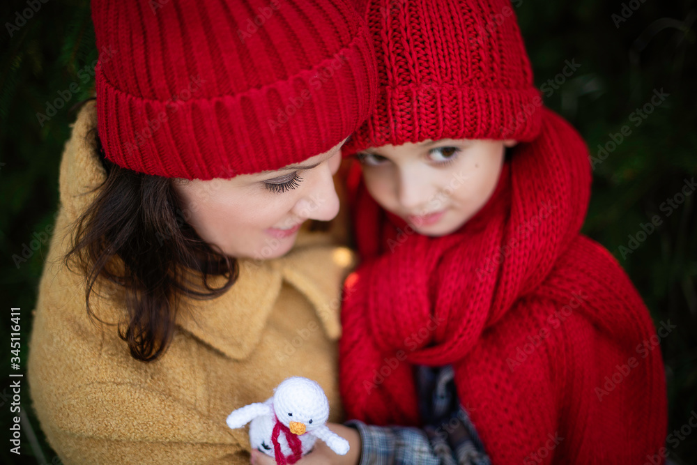 mother and a child candid moments hugging cuddling playng outside ...