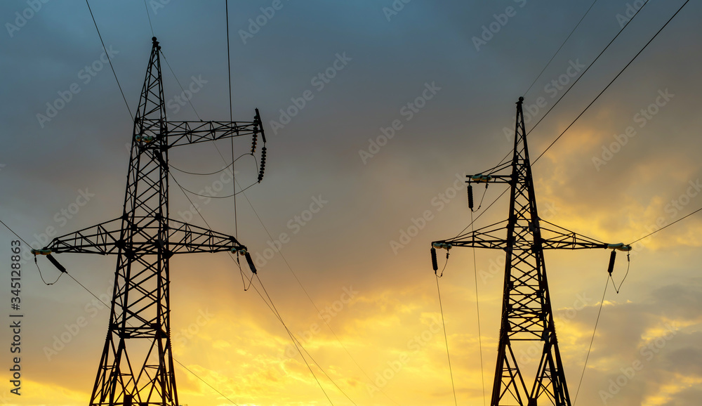 High-voltage power lines on sunset background Stock Photo | Adobe Stock