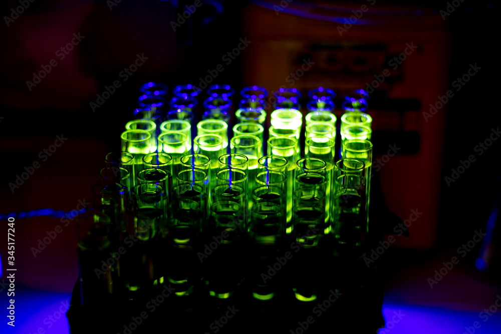 Glowing fluorescent compound collected from column chromatography in a ...
