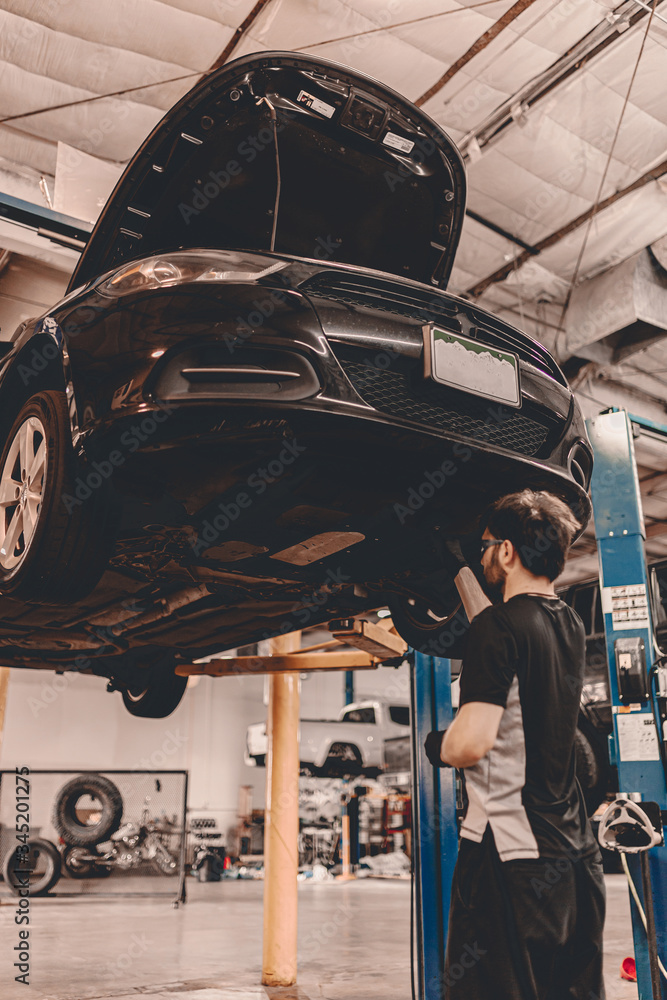 Car auto repair service. Oil change. Auto service. Mechanic man works ...