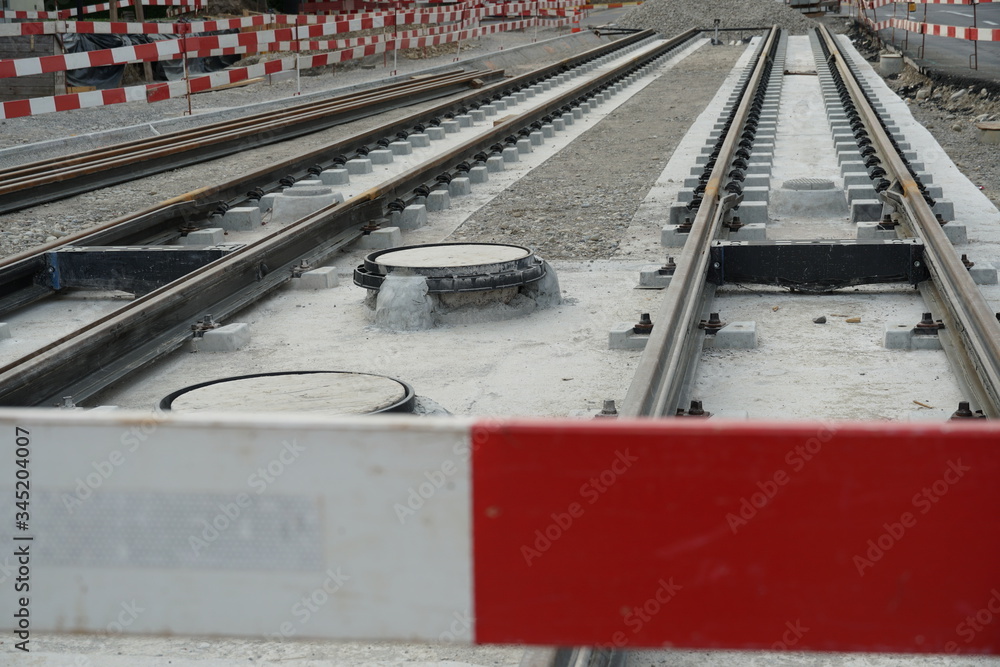Construction site of a street-car line, embedding of metal rails in a ...