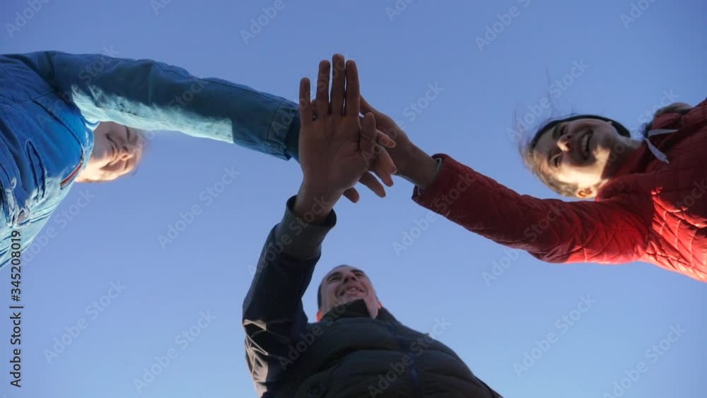 teamwork business a happy family . Stack of hands. Unity and teamwork ...
