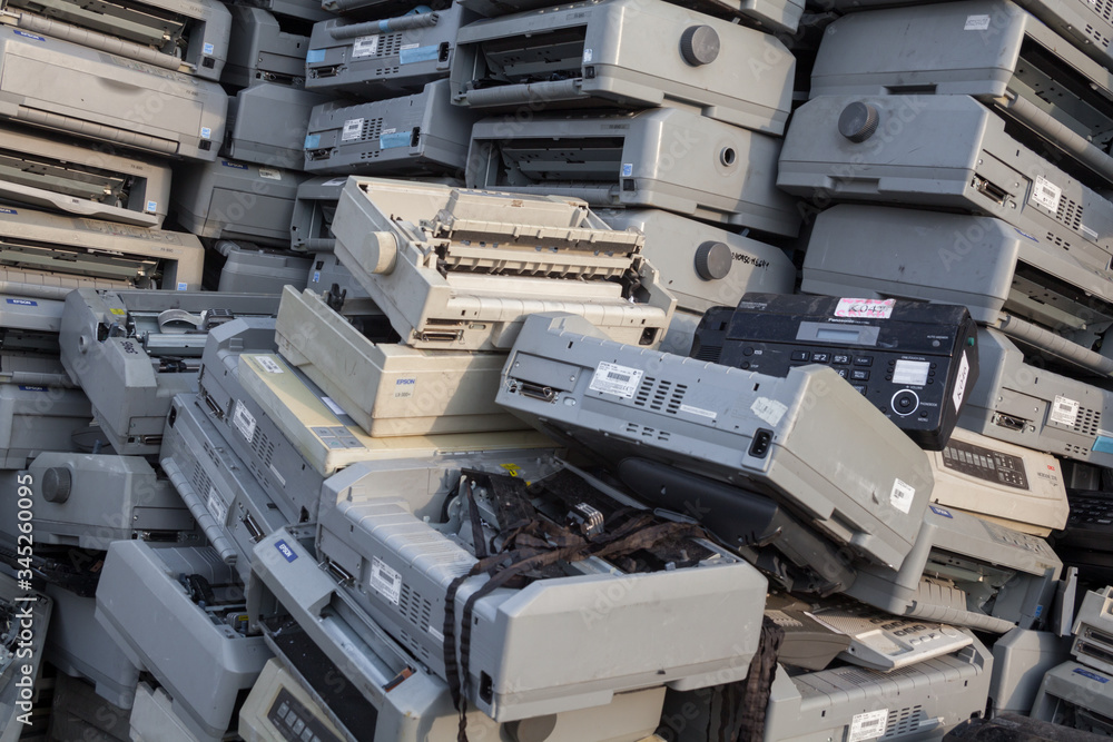 Pile of dot matrix printers on the landfill. Stock Photo | Adobe Stock