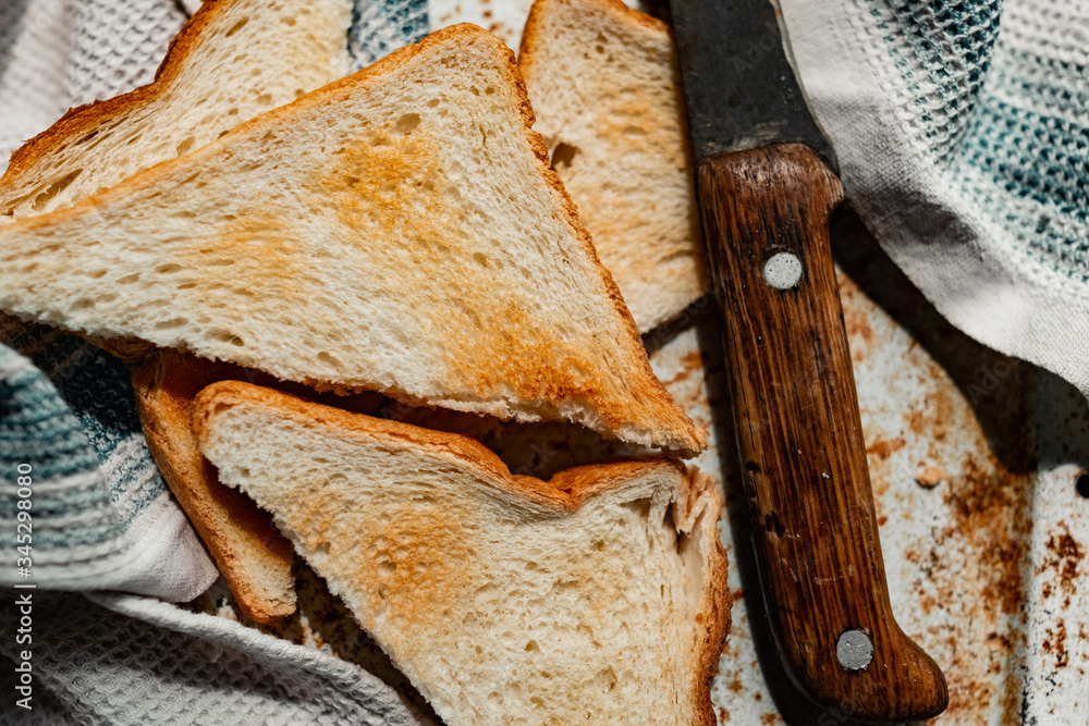 Triangular slices of toasted white bread with a soft texture inside and ...