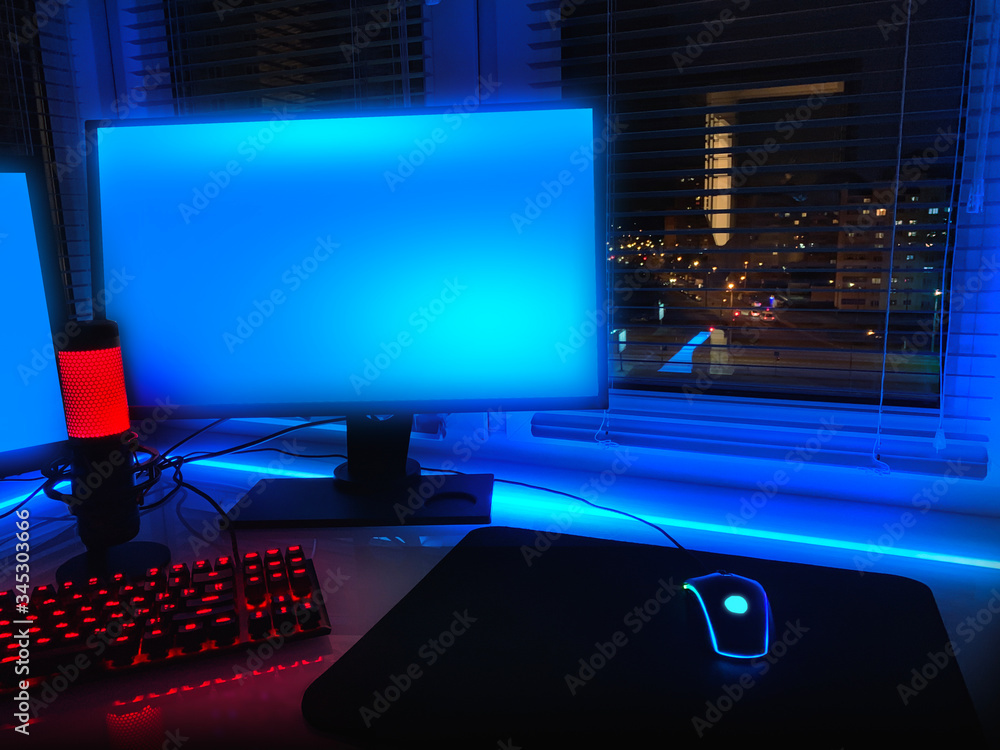 Dark room for a gamer with a computer table, neon lights. Gamezone ...