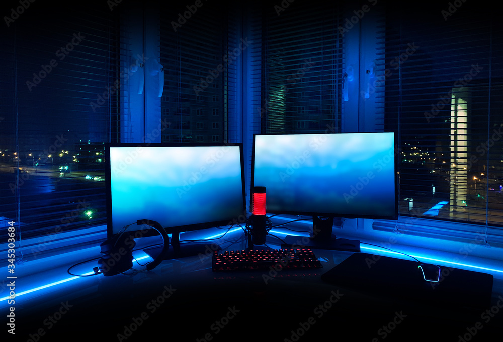 Dark room for a gamer with a computer table, neon lights. Gamezone ...