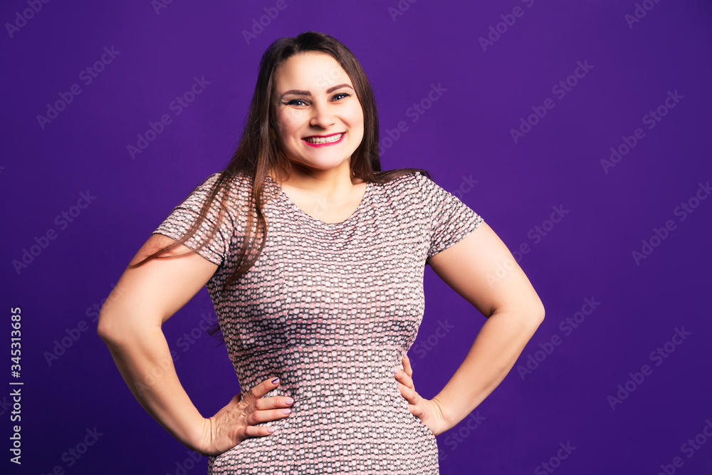 Happy plus size model smiling with teeth, fat woman on purple ...