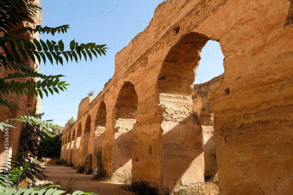 The ancient ruined arches of the massive Royal Stables, Meknes in ...