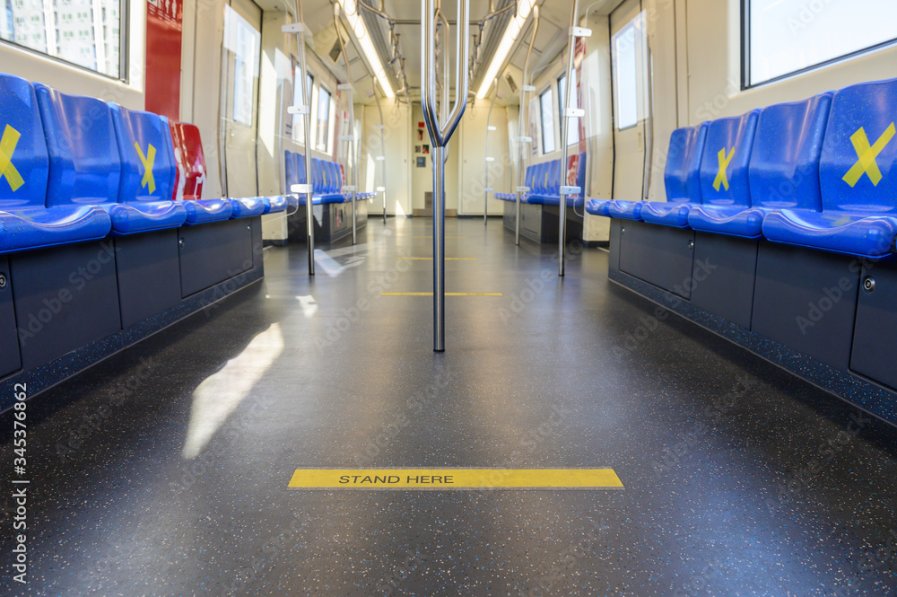 Stand lines on the floor in public train with social distancing protect ...